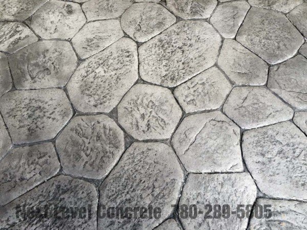Random Stone Stamped Concrete - Next Level Concrete Ltd