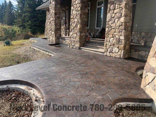 Random Stone Stamped Concrete - Next Level Concrete Ltd